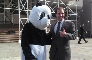 GOP Candidate Holds Presser Standing Next to Someone in a Panda Suit