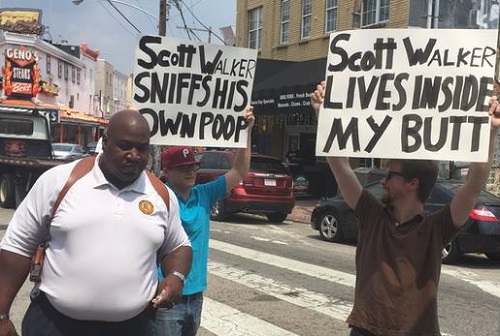 Scott Walker Trolled By 'Poop' and 'Butt' Signs During Philly Visit