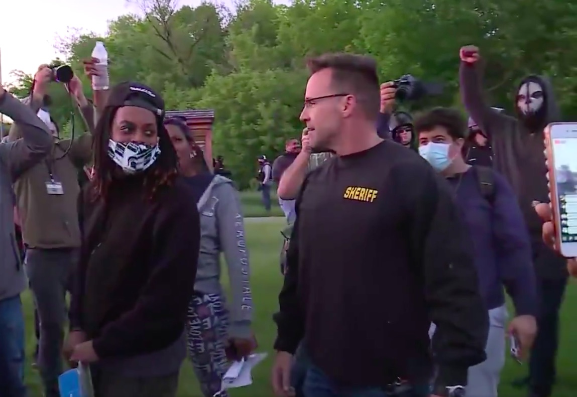 Sheriff and Officers Join Protesters in Flint, Michigan