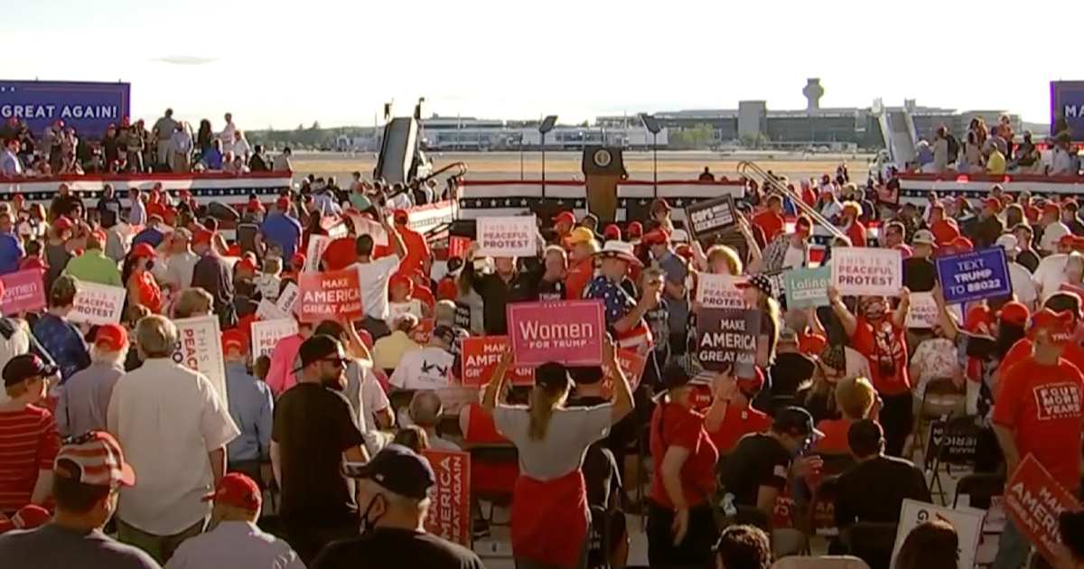 Trump Rallygoers Hold 'Peaceful Protest' Signs, Boo Mask Request