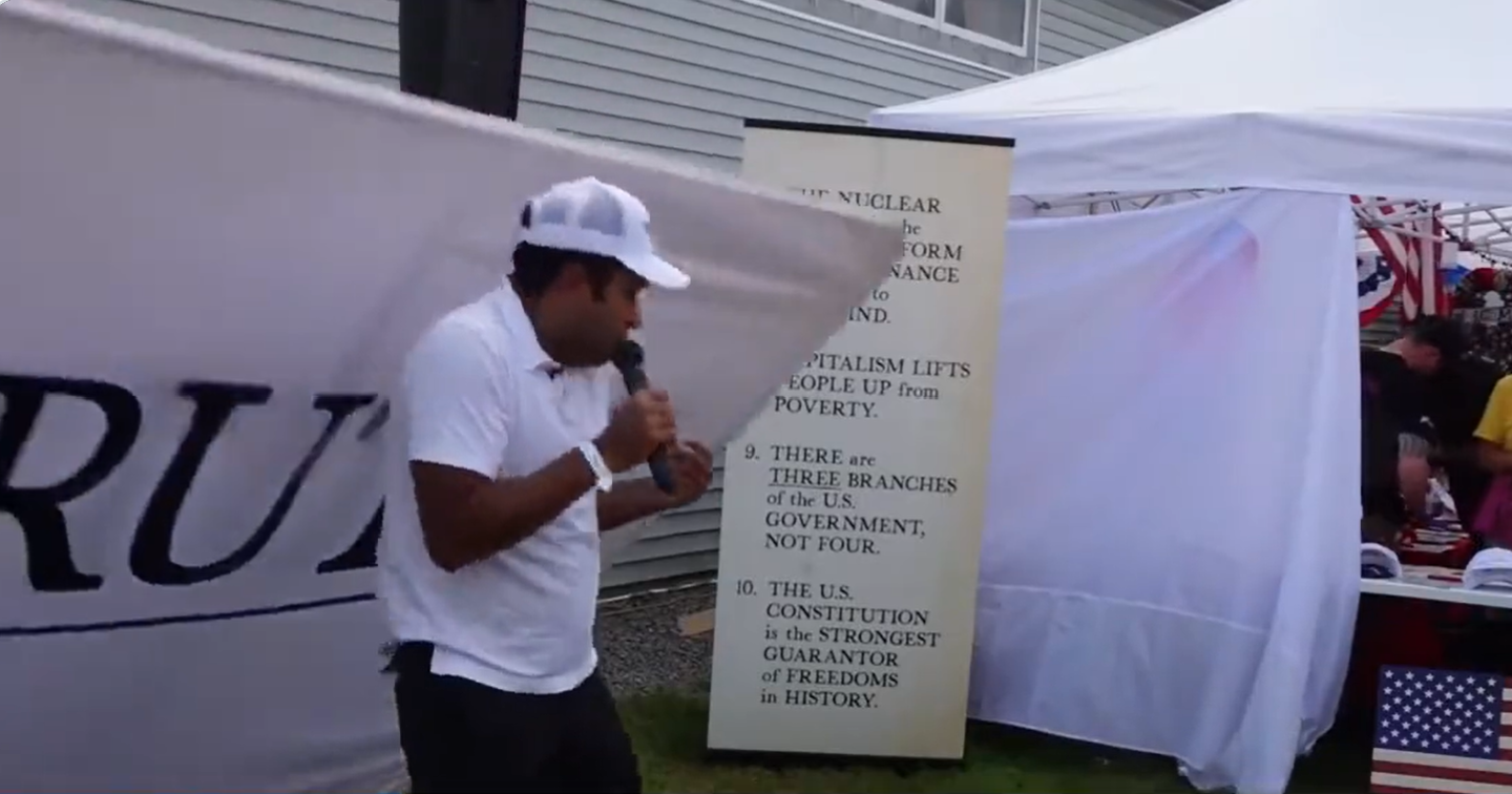 A Giant TRUTH Banner Whacks Vivek Ramaswamy Upside the Head