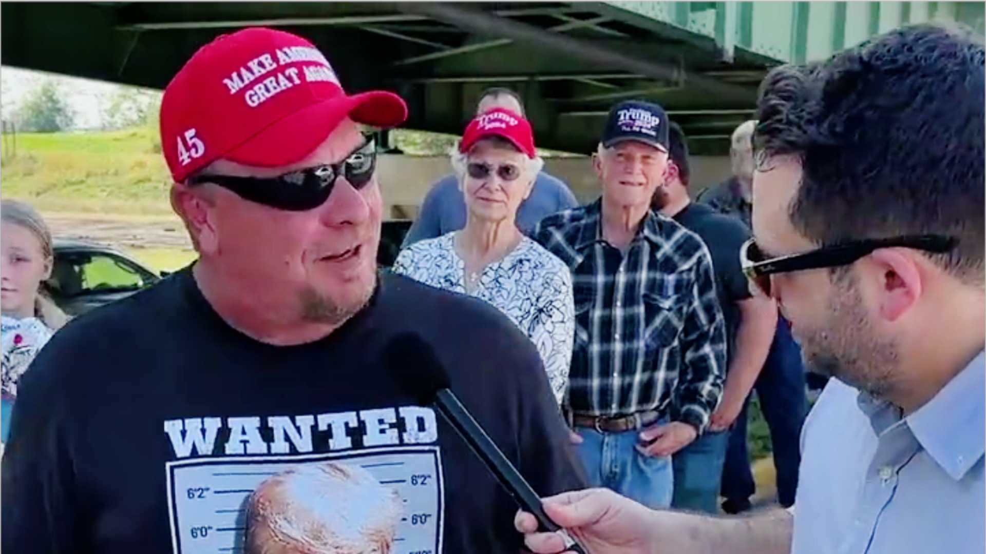 Trump Rally Fan Confronted On Never Surrender Mugshot Shirt