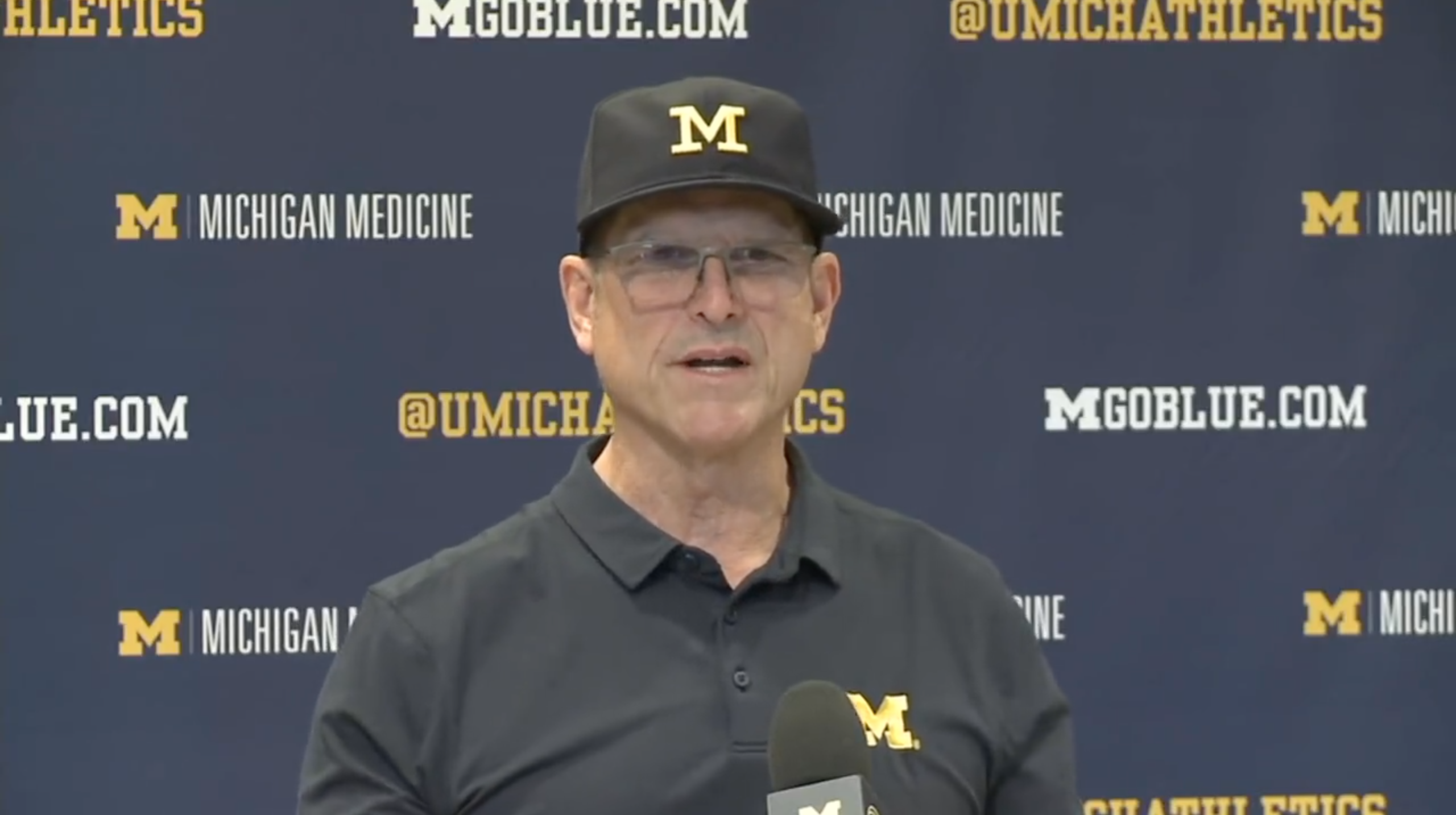 Suspended Jim Harbaugh Calls Wolverines "America's Team"