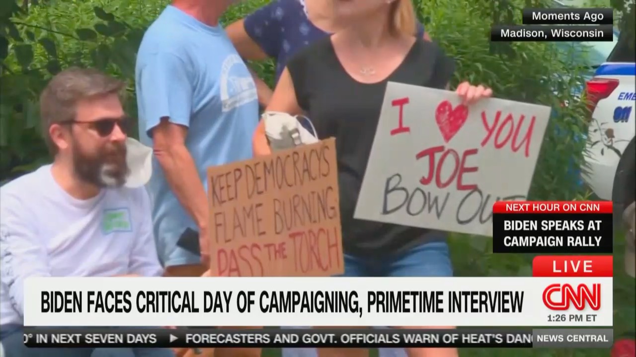Wisconsin Residents Hold Up Signs Asking Biden to Drop Out