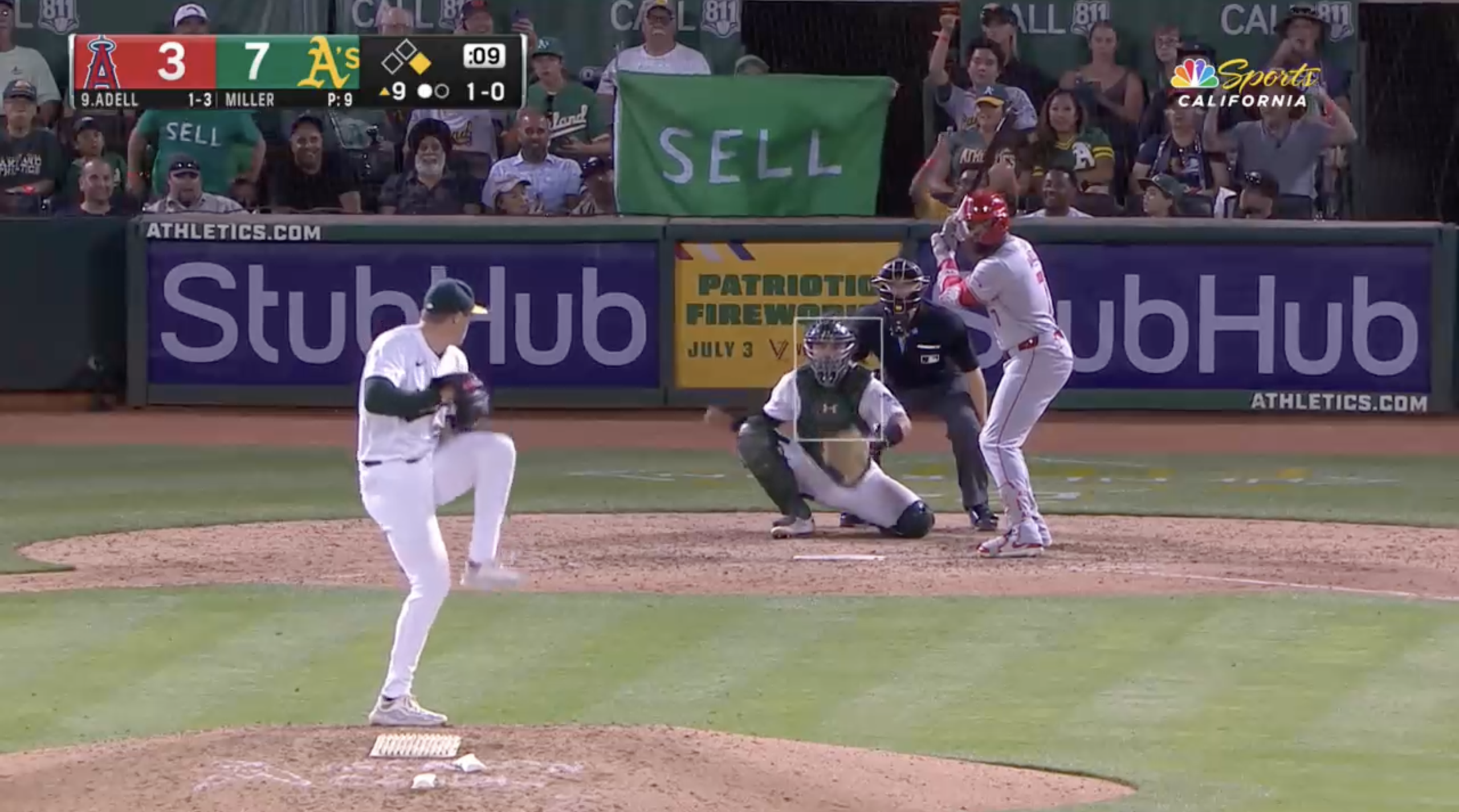 Oakland A's Fan Holds "Sell" Flag Right Behind Home Plate