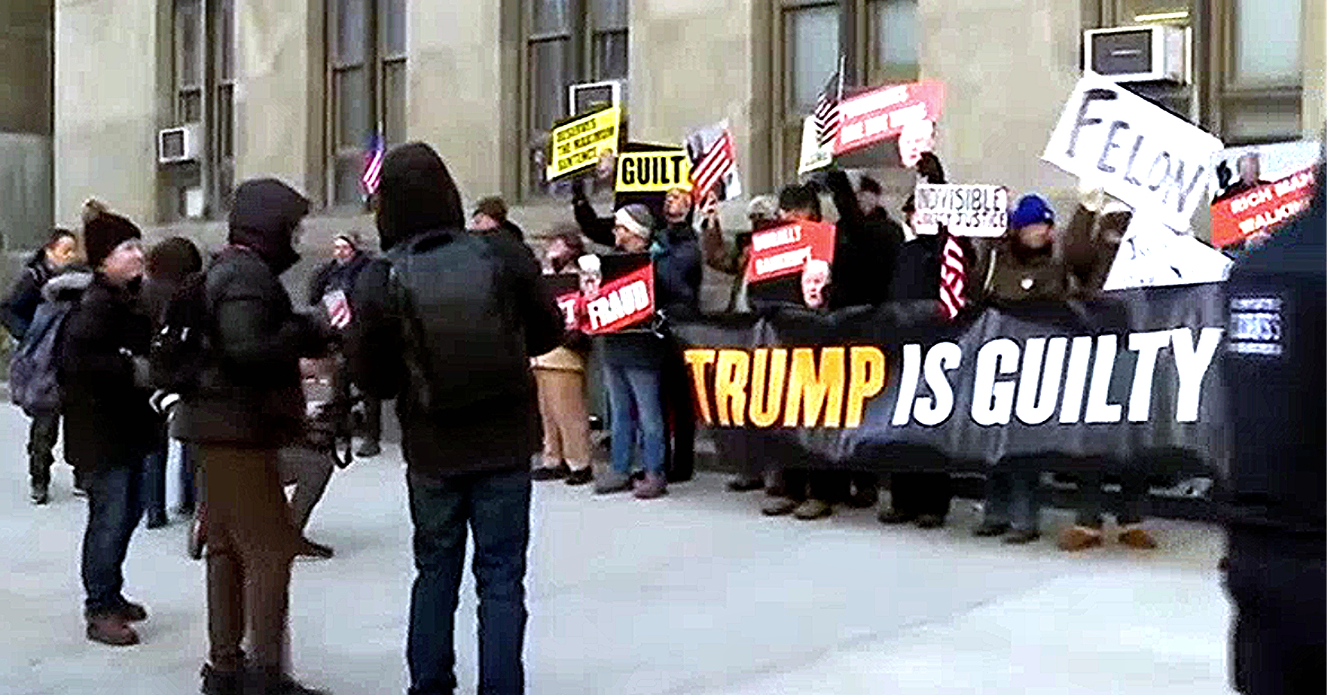 Trump Fan Heckles Protesters With Felon Signs at Sentencing